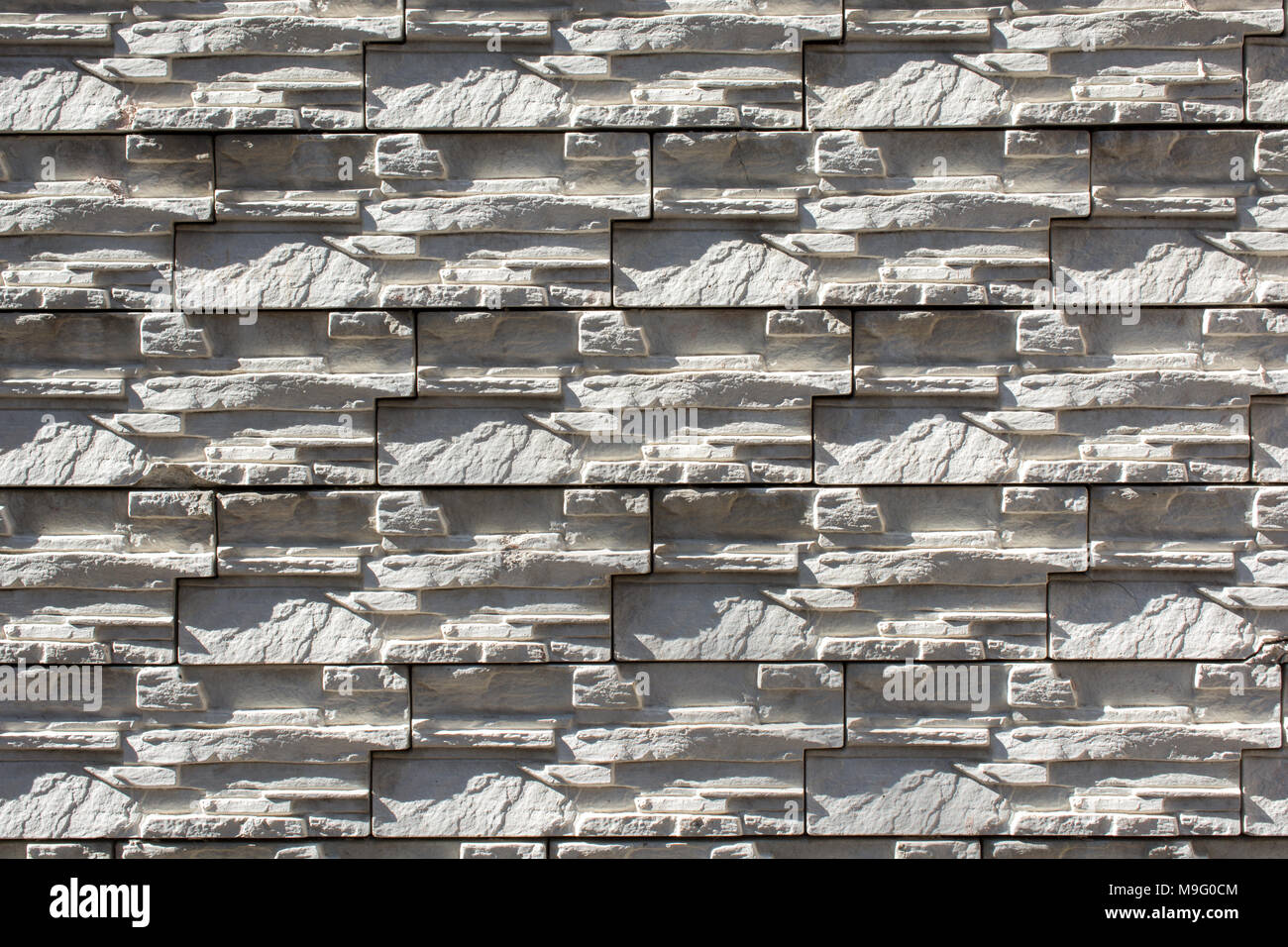 Decorative stone background built of little stones Stock Photo - Alamy
