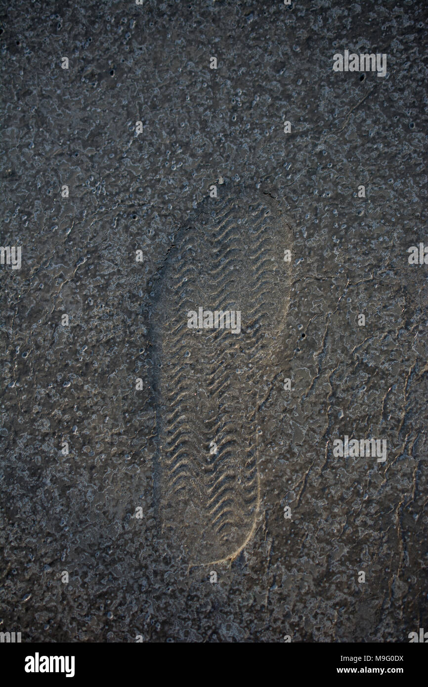 Footstep pattern seen on a concrete background Stock Photo - Alamy