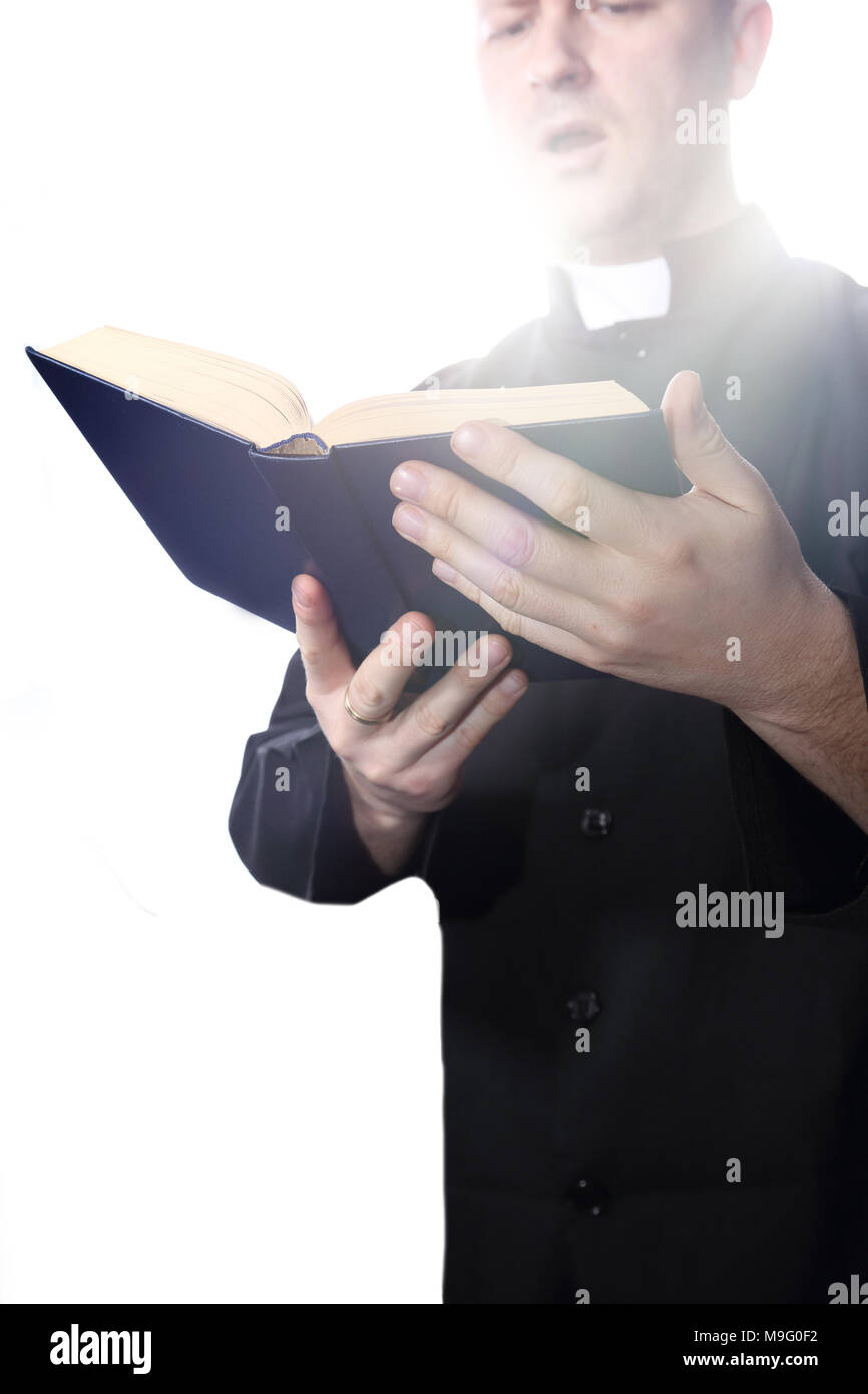 priest with a holy script on a white background Stock Photo - Alamy