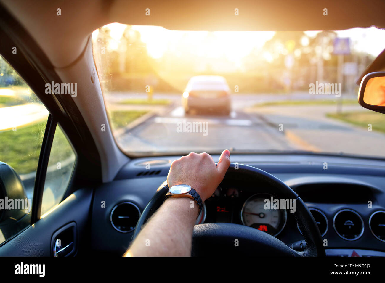Driving in the sun on a car Stock Photo - Alamy