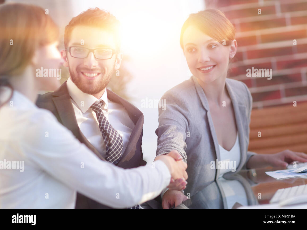 business woman greets the employee with a handshake Stock Photo - Alamy