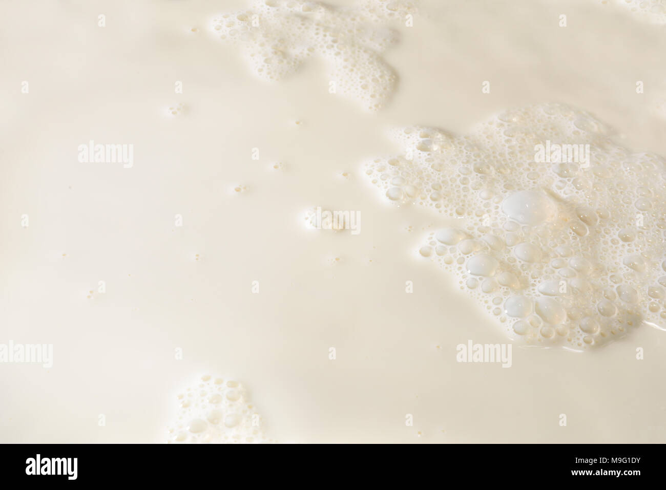 Milk texture background with foam and bubbles on the surface ...