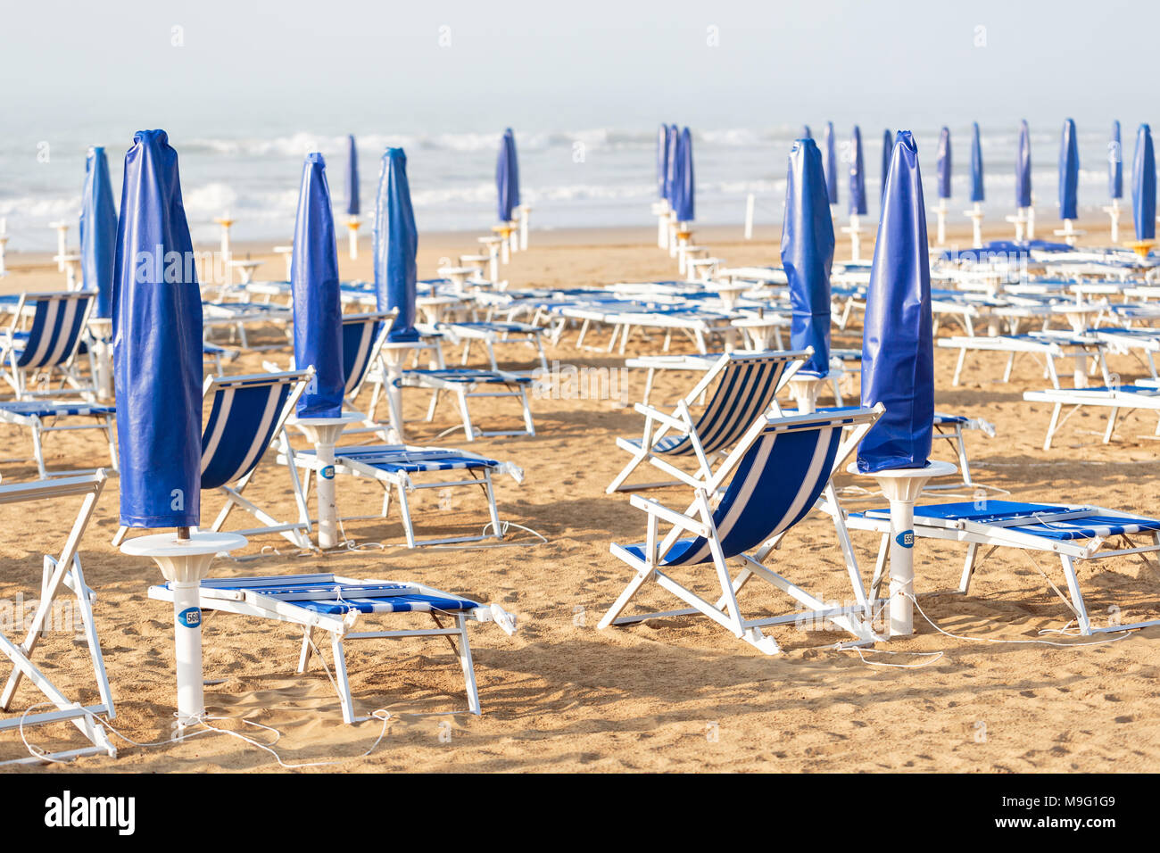 on the sandy beach cleaning, after winter, preparation for the holiday ...