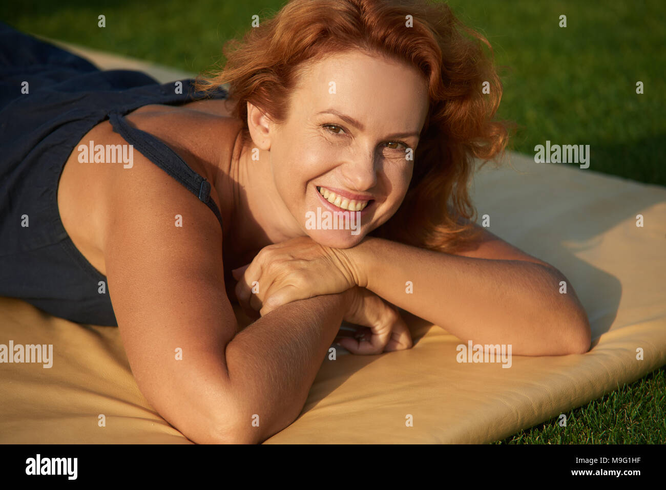 Mature women lying on meadow hi-res stock photography and images - Alamy