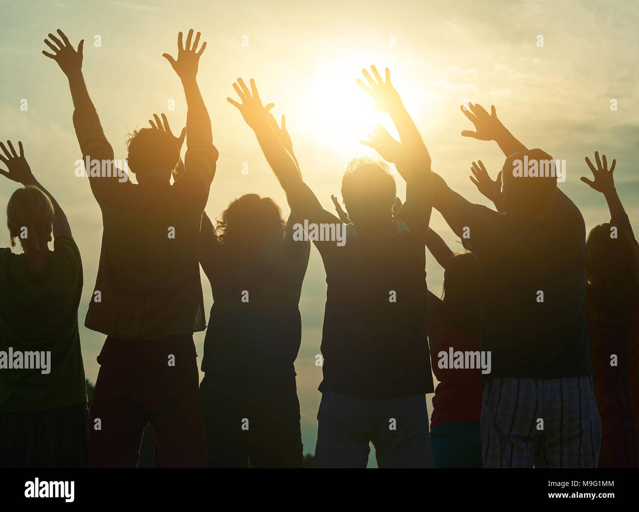 Fans at open air concert, back view. Open-air rave party. Raising hands ...
