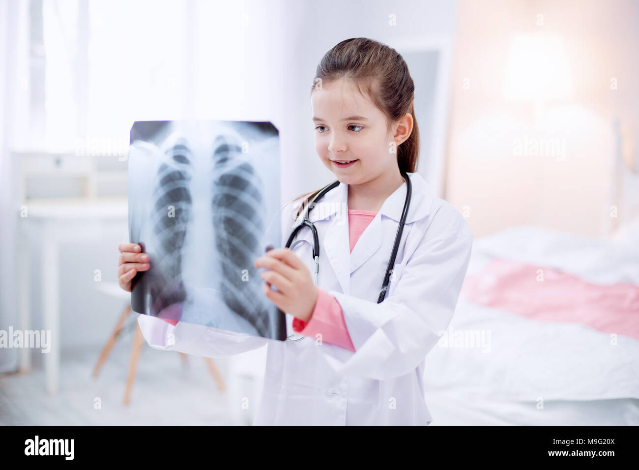 Nice positive girl studying radiography Stock Photo - Alamy