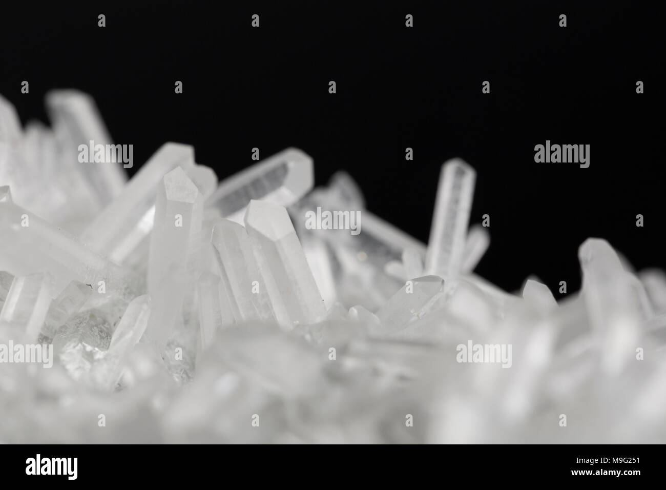 Pure Quartz Crystal cluster on black background Stock Photo - Alamy
