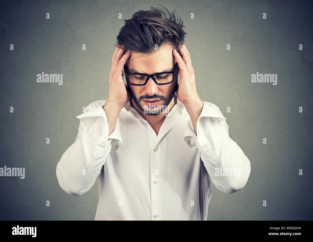 Young sad unhappy man with problems looking miserable and stressed ...