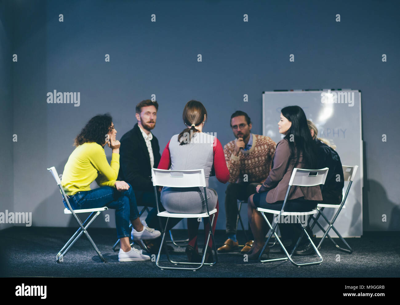 Large group of people having a counseling session Stock Photo - Alamy