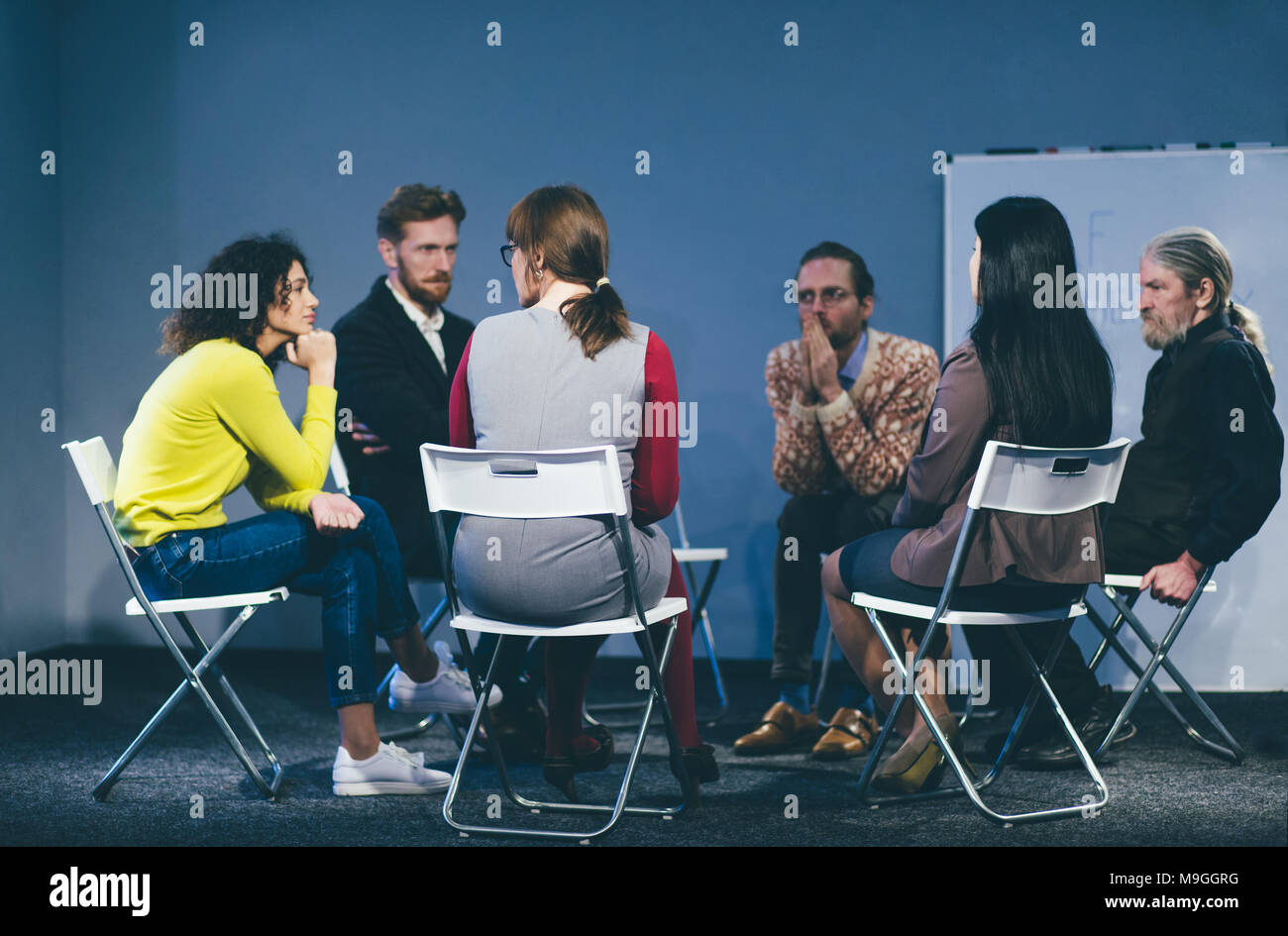 Large group of people having a counseling session Stock Photo - Alamy