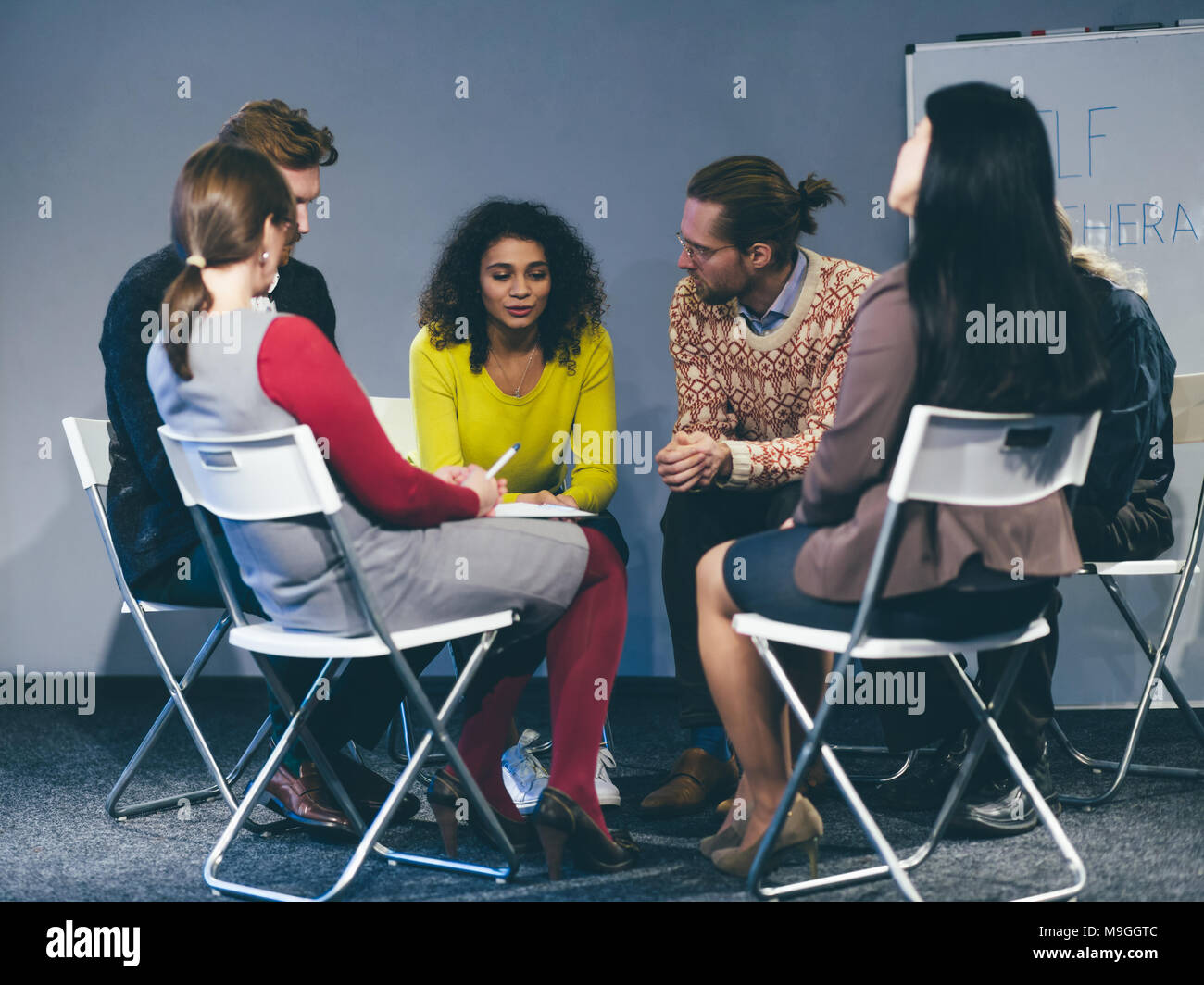 Large group of people having a counseling session Stock Photo - Alamy