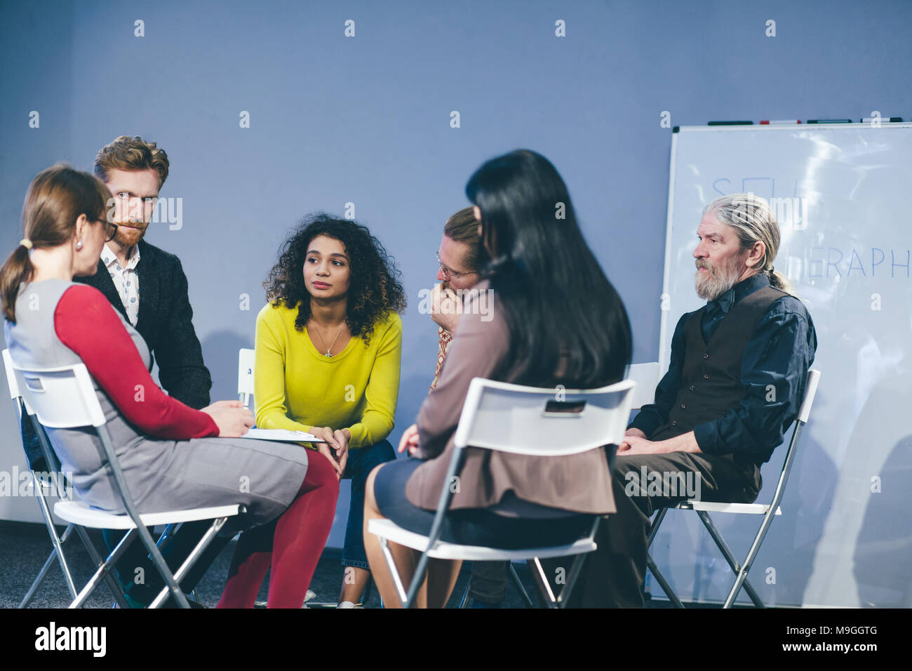 Large group of people having a counseling session Stock Photo - Alamy