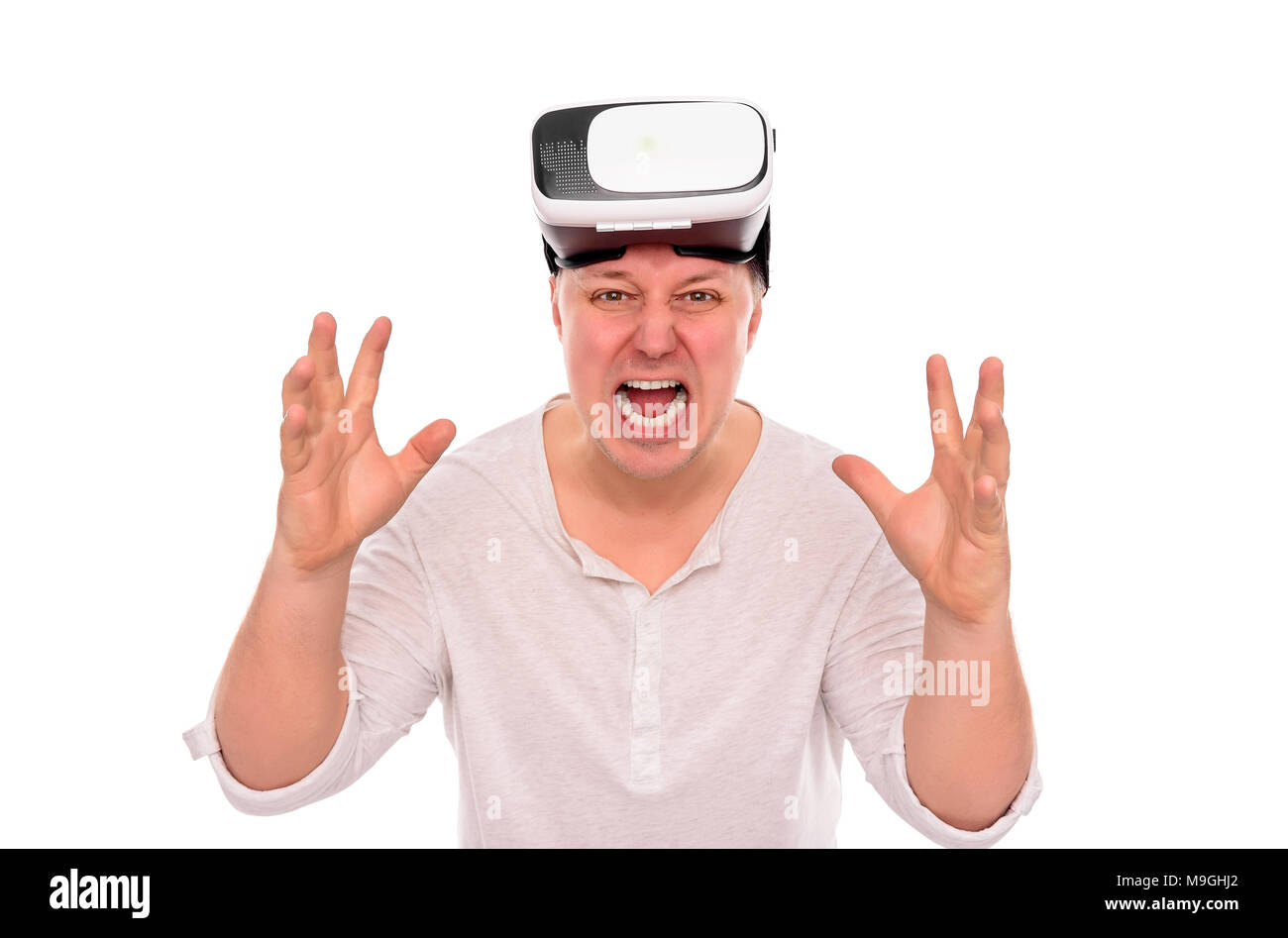 Angry man with glasses or a helmet of virtual reality on his head on a ...