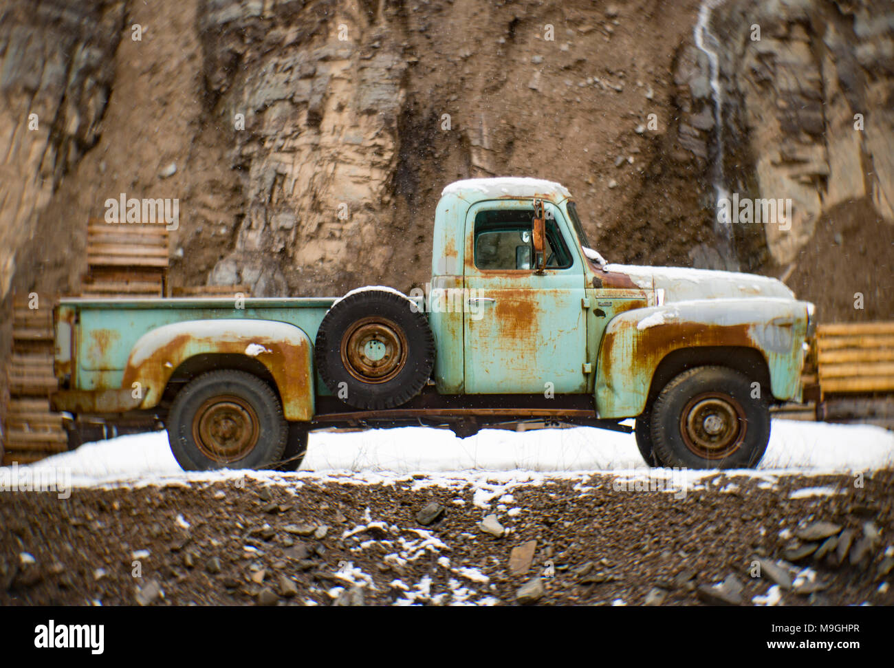 A blue 1957 International S120 stepside pickup truck, in an old quarry ...