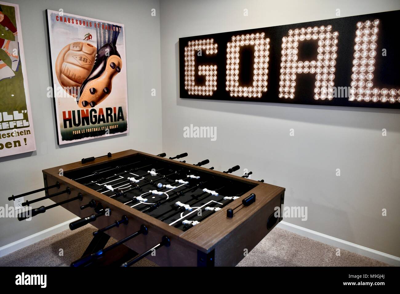 Foosball table inside modern home Stock Photo - Alamy