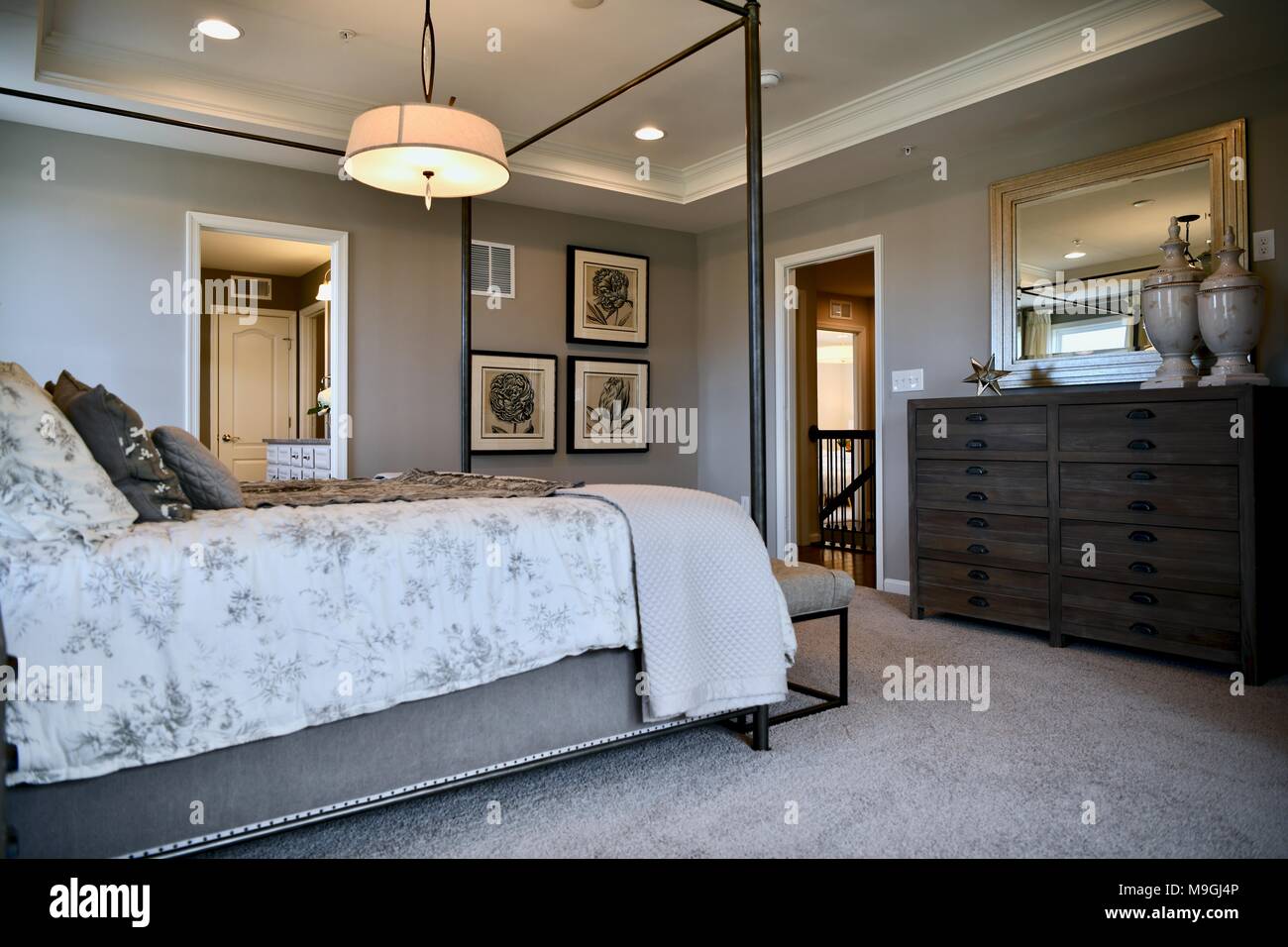 View of modern bedroom with bed inside decorated home Stock Photo - Alamy