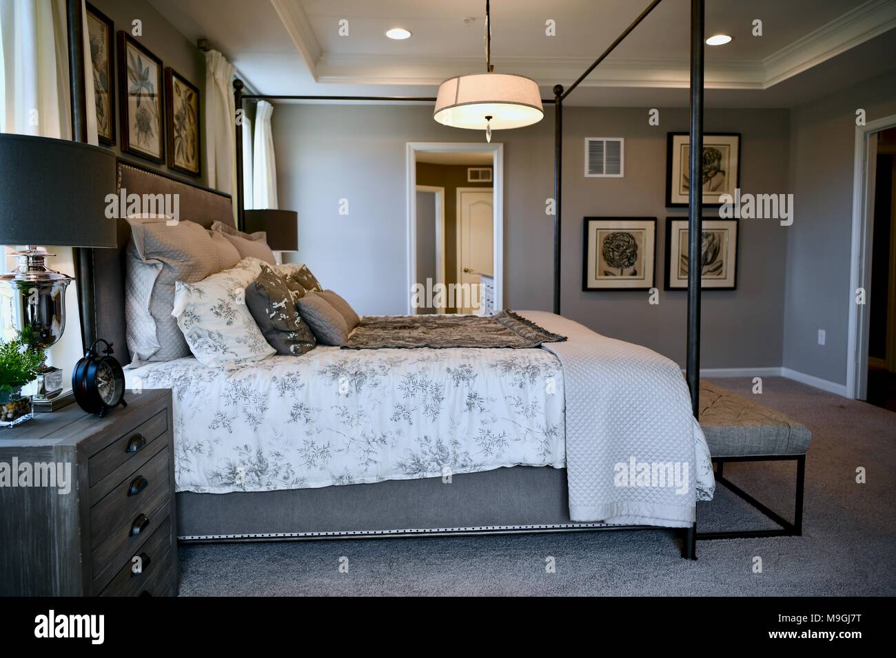View of modern bedroom with bed inside decorated home Stock Photo - Alamy