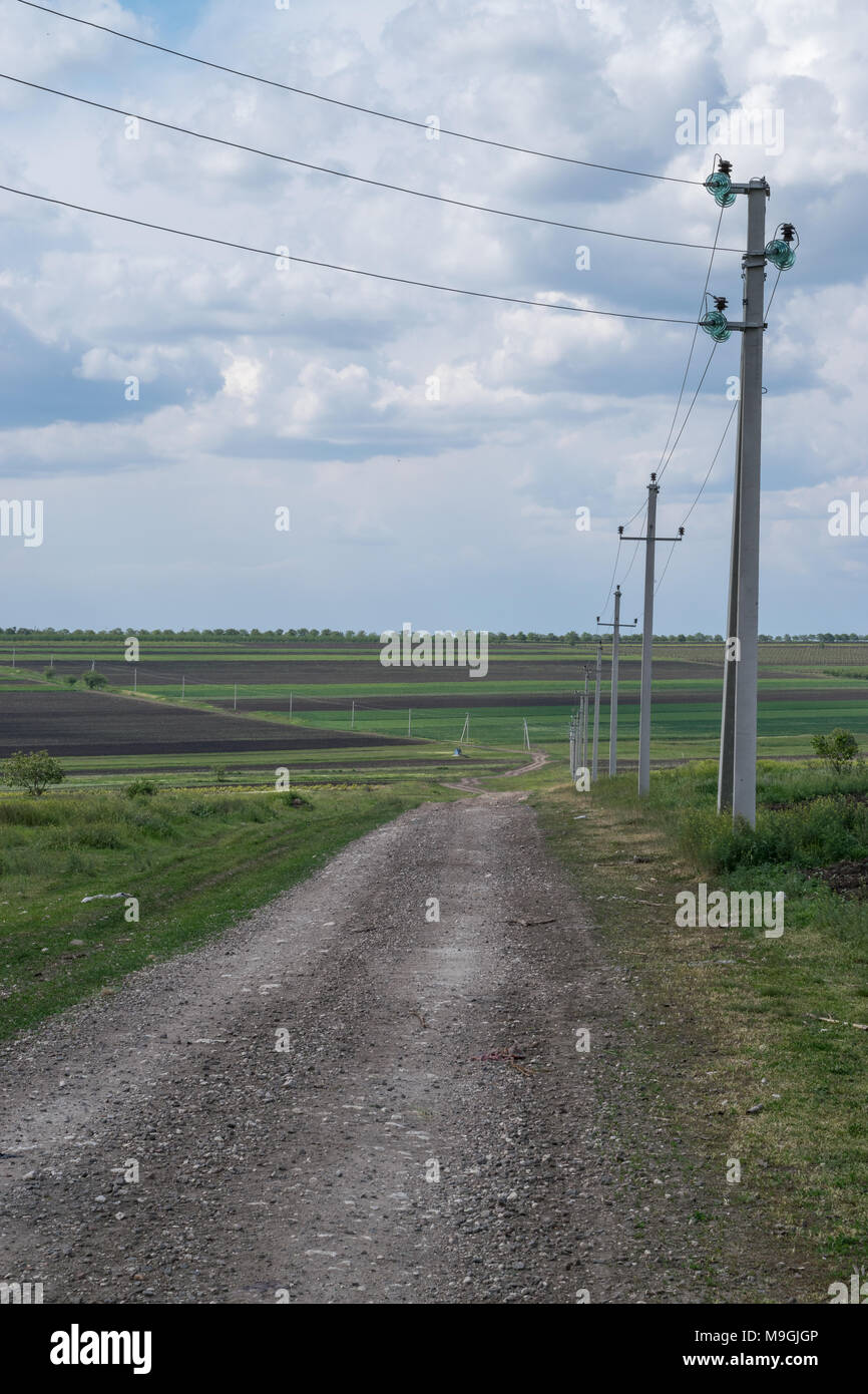 A road with electricity pillars on the edge Stock Photo - Alamy