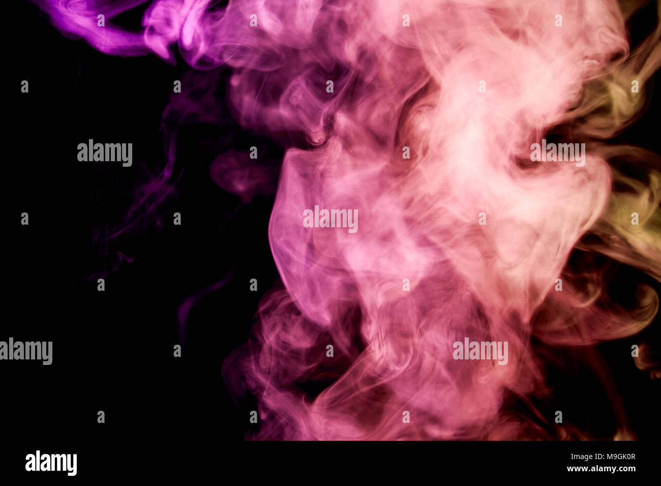 Colorful pink and red smoke on a black isolated background. Background ...