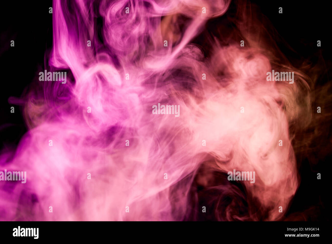 Colorful pink and red smoke on a black isolated background. Background ...