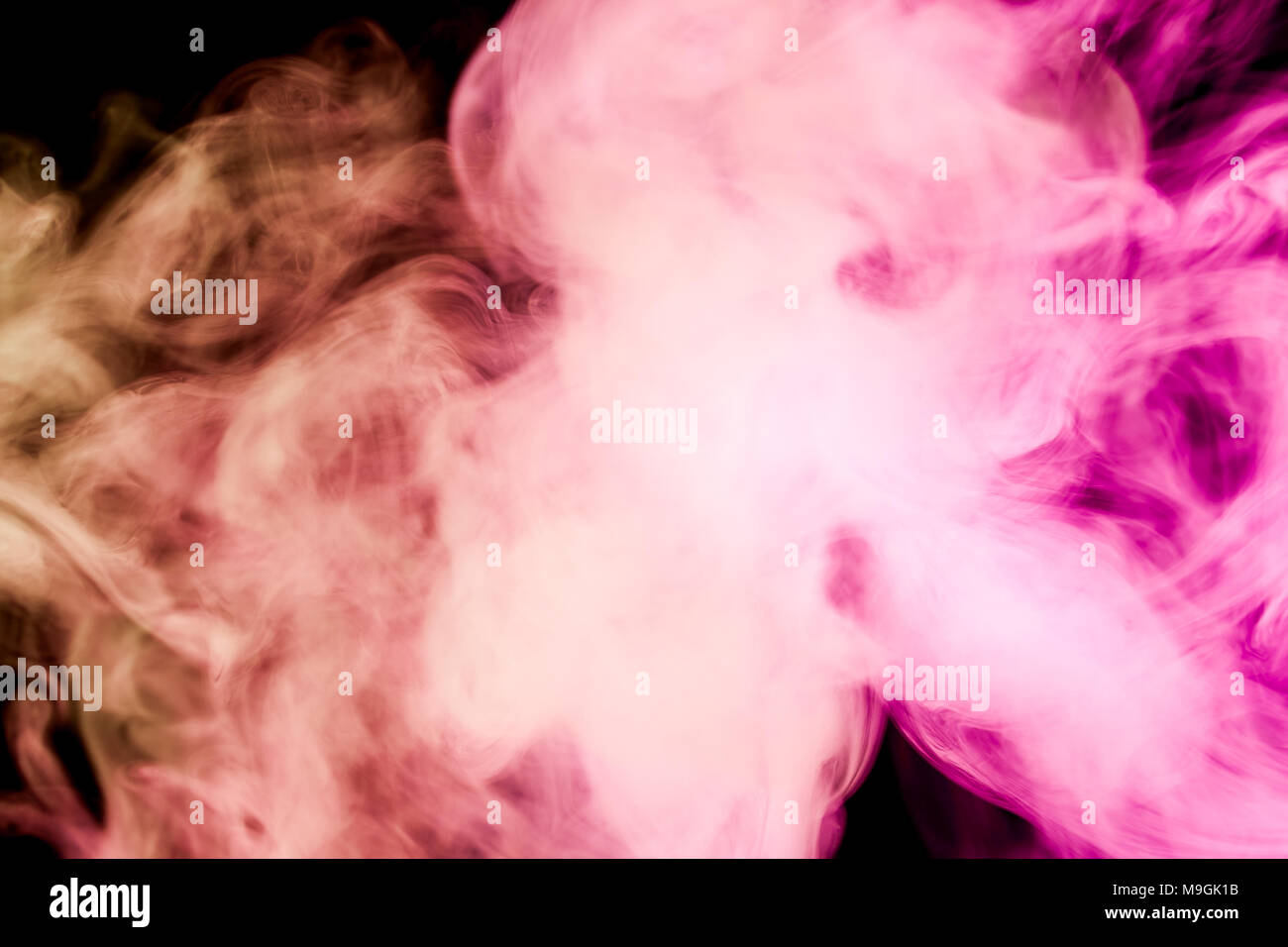 Colorful pink and red smoke on a black isolated background. Background ...