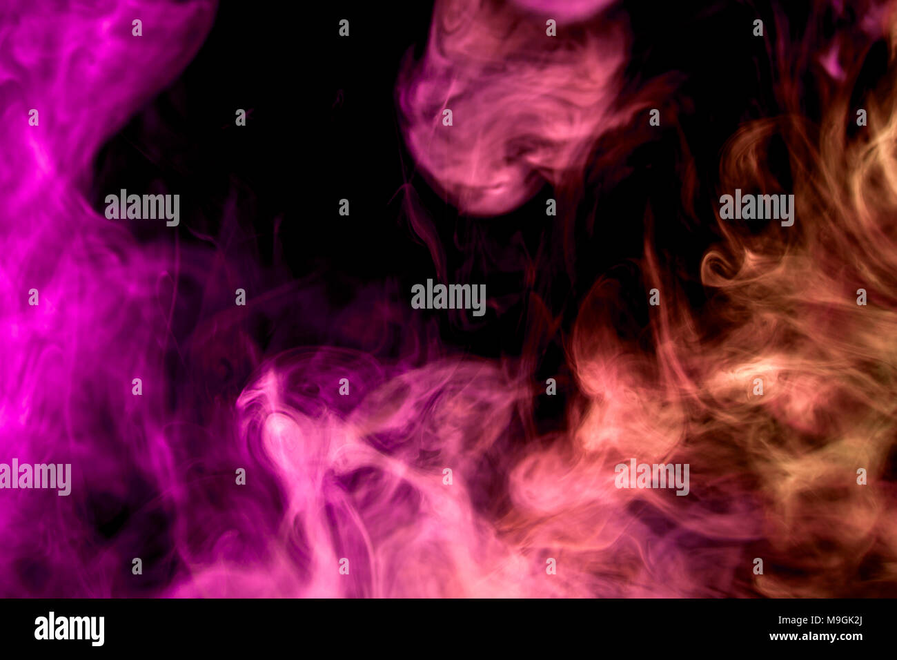 Colorful pink and red smoke on a black isolated background. Background ...