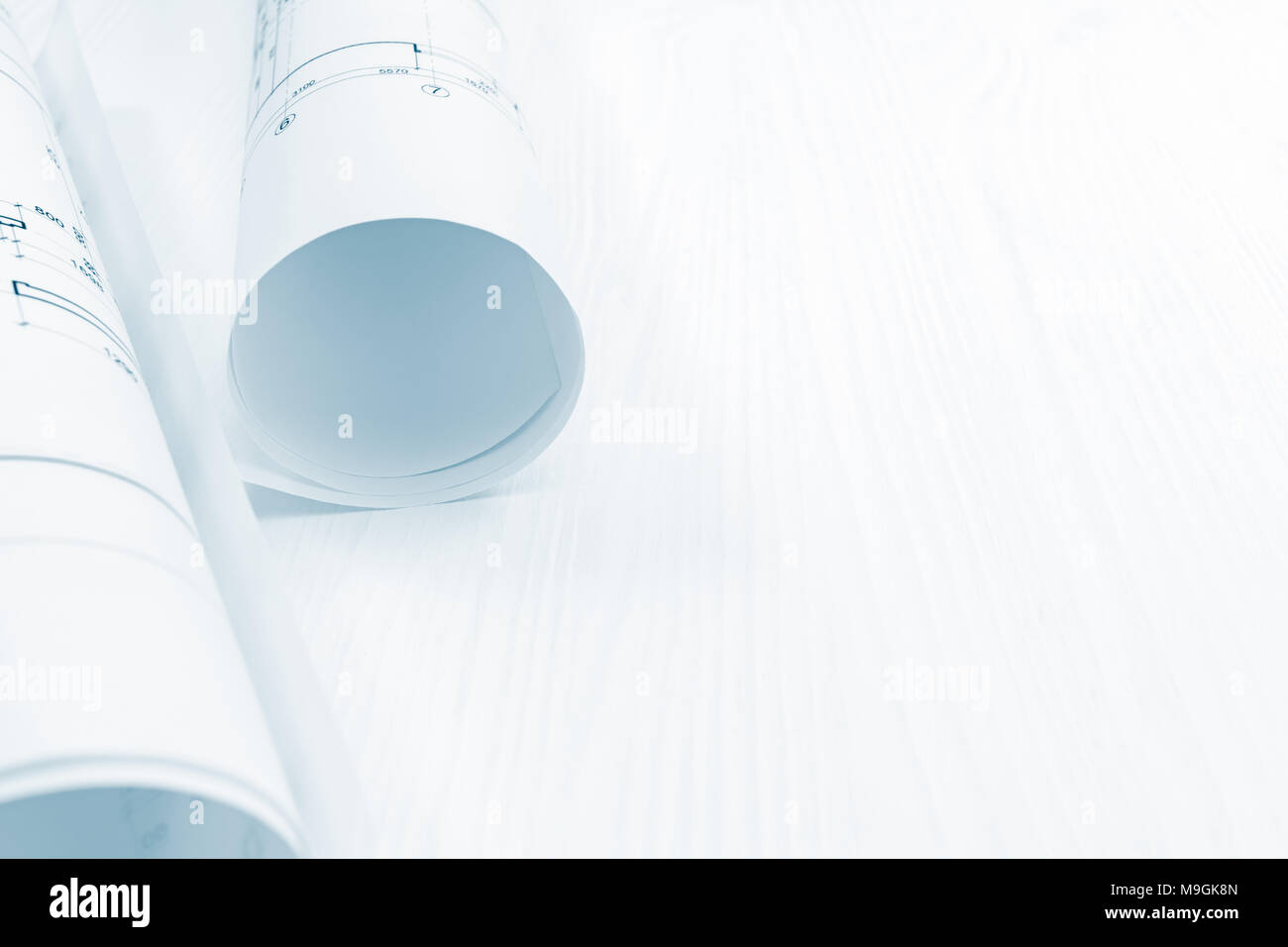 roll of blueprints and engineering projects. architect workplace ...