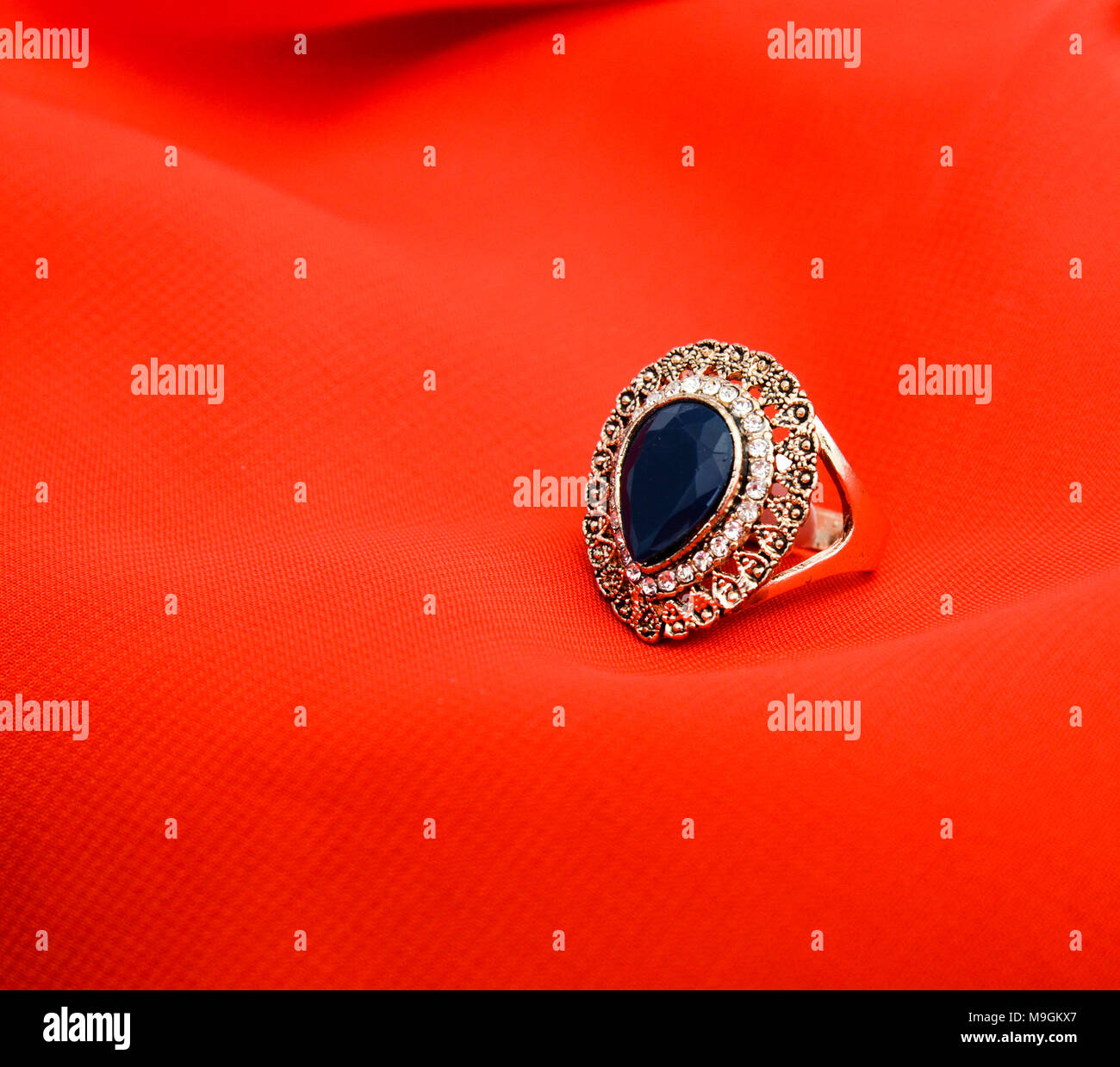 picture of a Fashion ring. Red background Stock Photo - Alamy