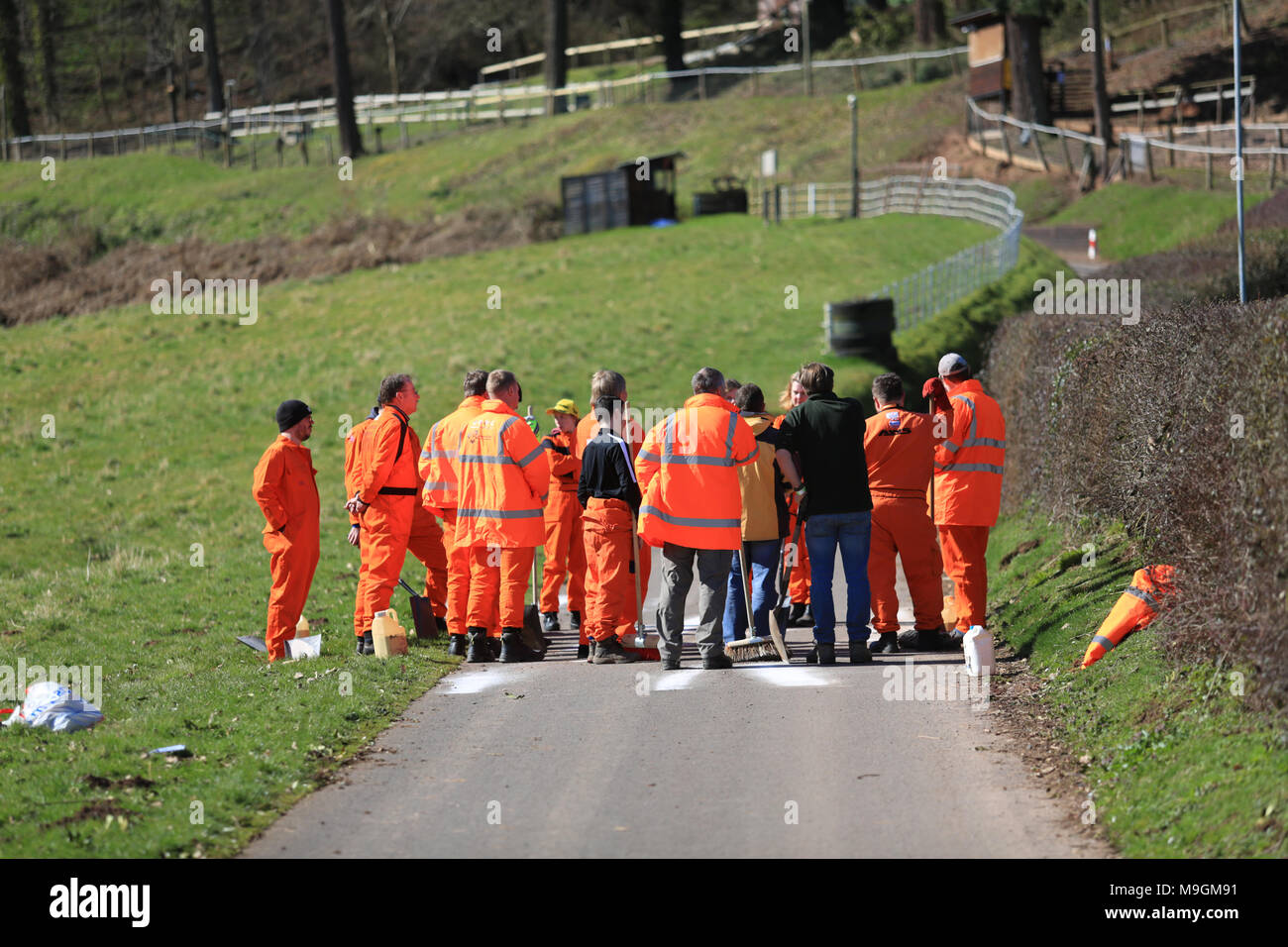 Motor sport marshals being trained in dealing with fluid spills Stock ...
