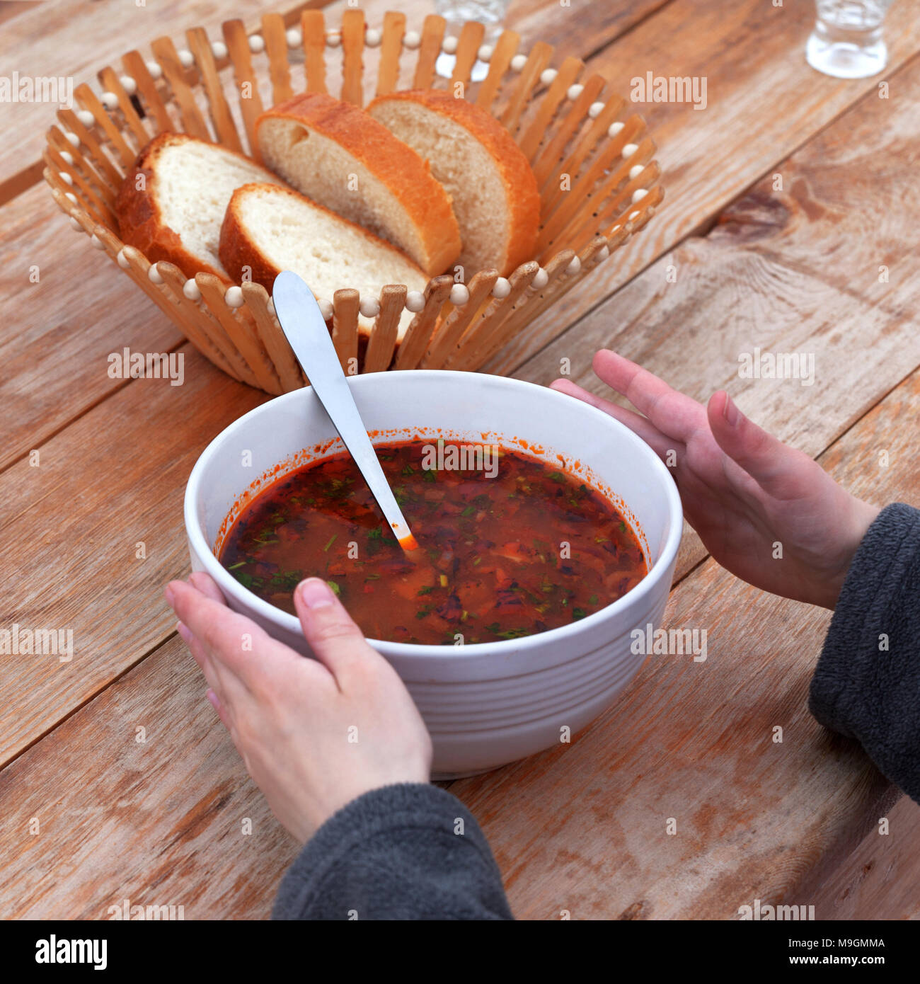 Winter vacation. Lunch with kharcho in outdoor cafe at ski resort in ...