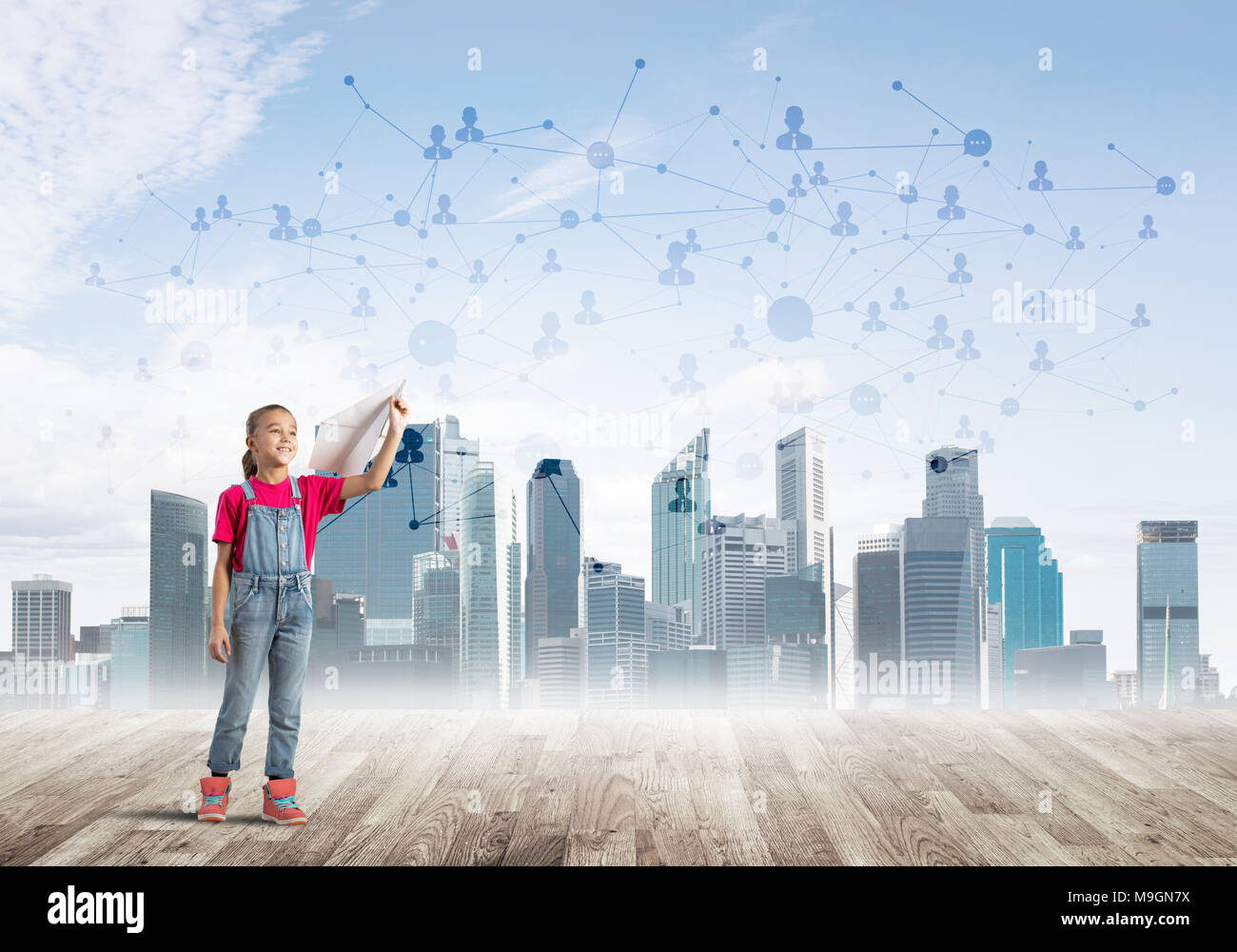 Cute kid girl standing on wooden floor and play with plane Stock Photo ...