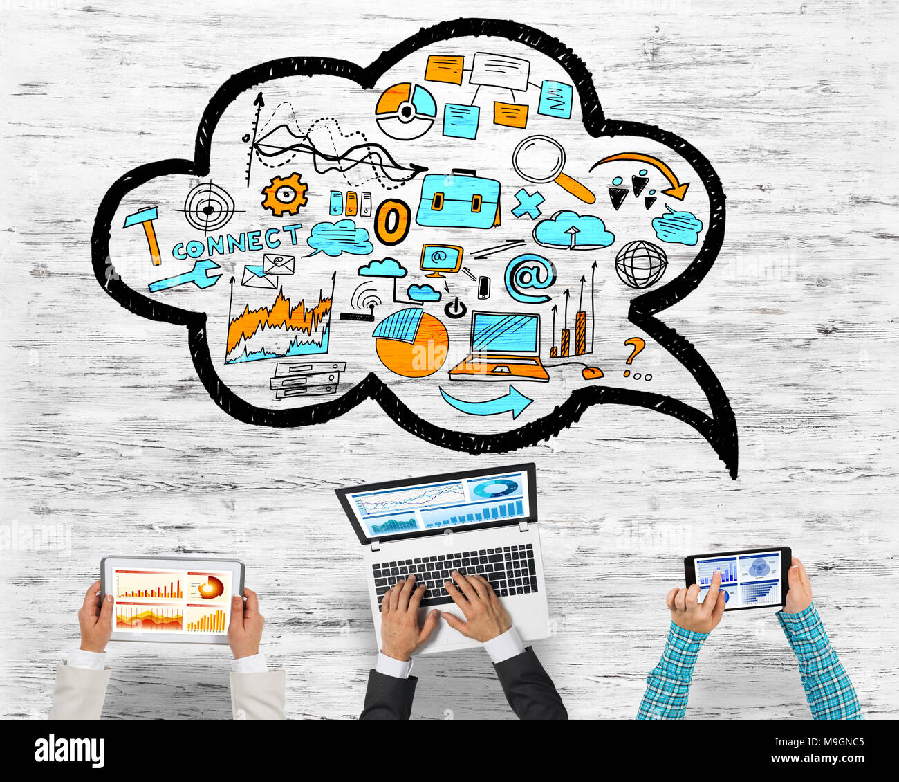 Group of people with devices in hands working together as symbol of ...