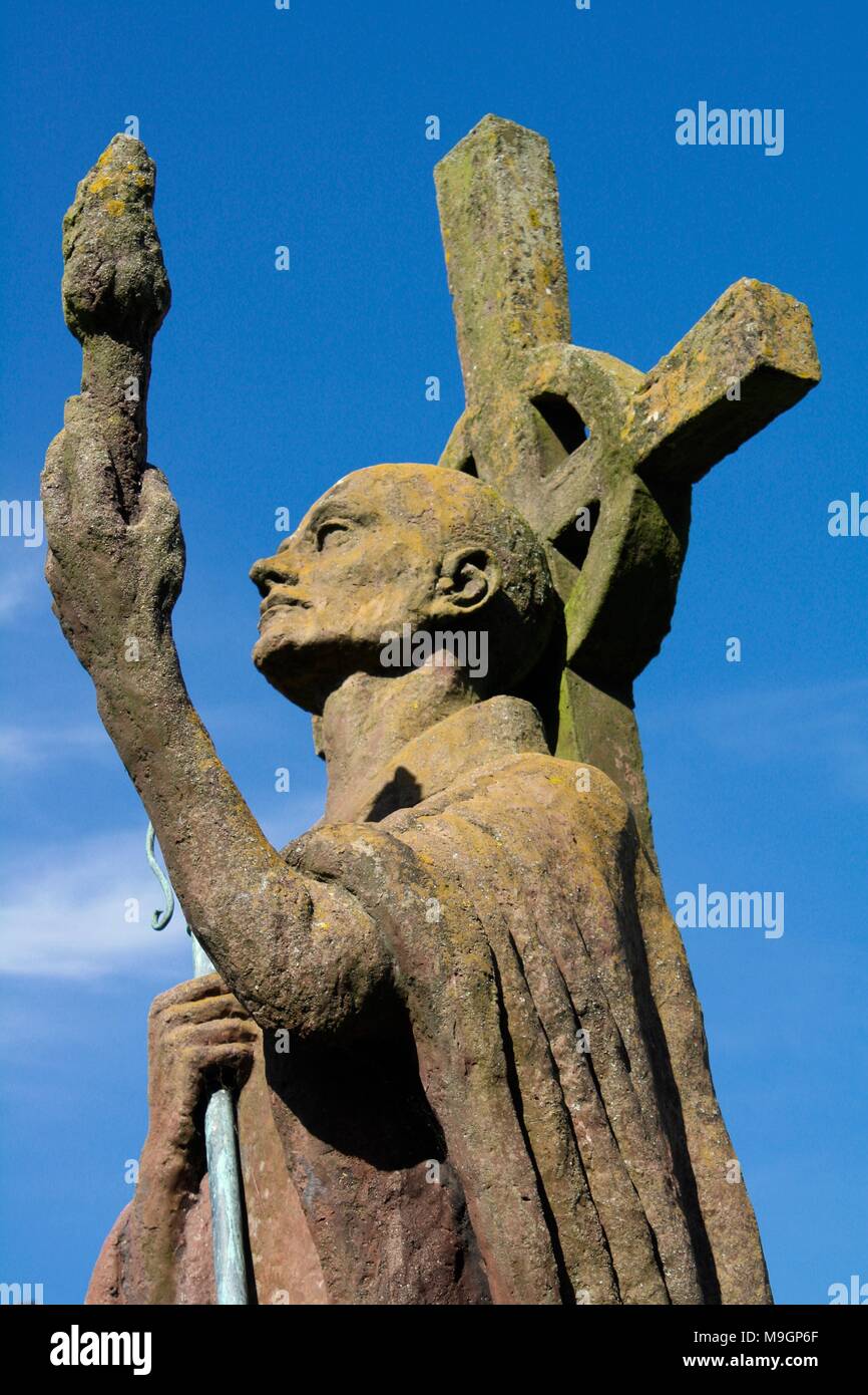 Statue of Saint Cuthbert with Celtic cross, Lindisfarne Stock Photo - Alamy