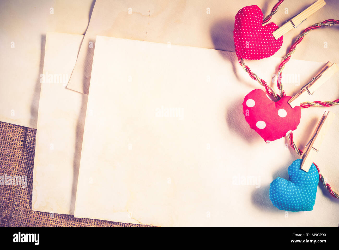 Handmade love hearts and sheets of blank paper Stock Photo - Alamy