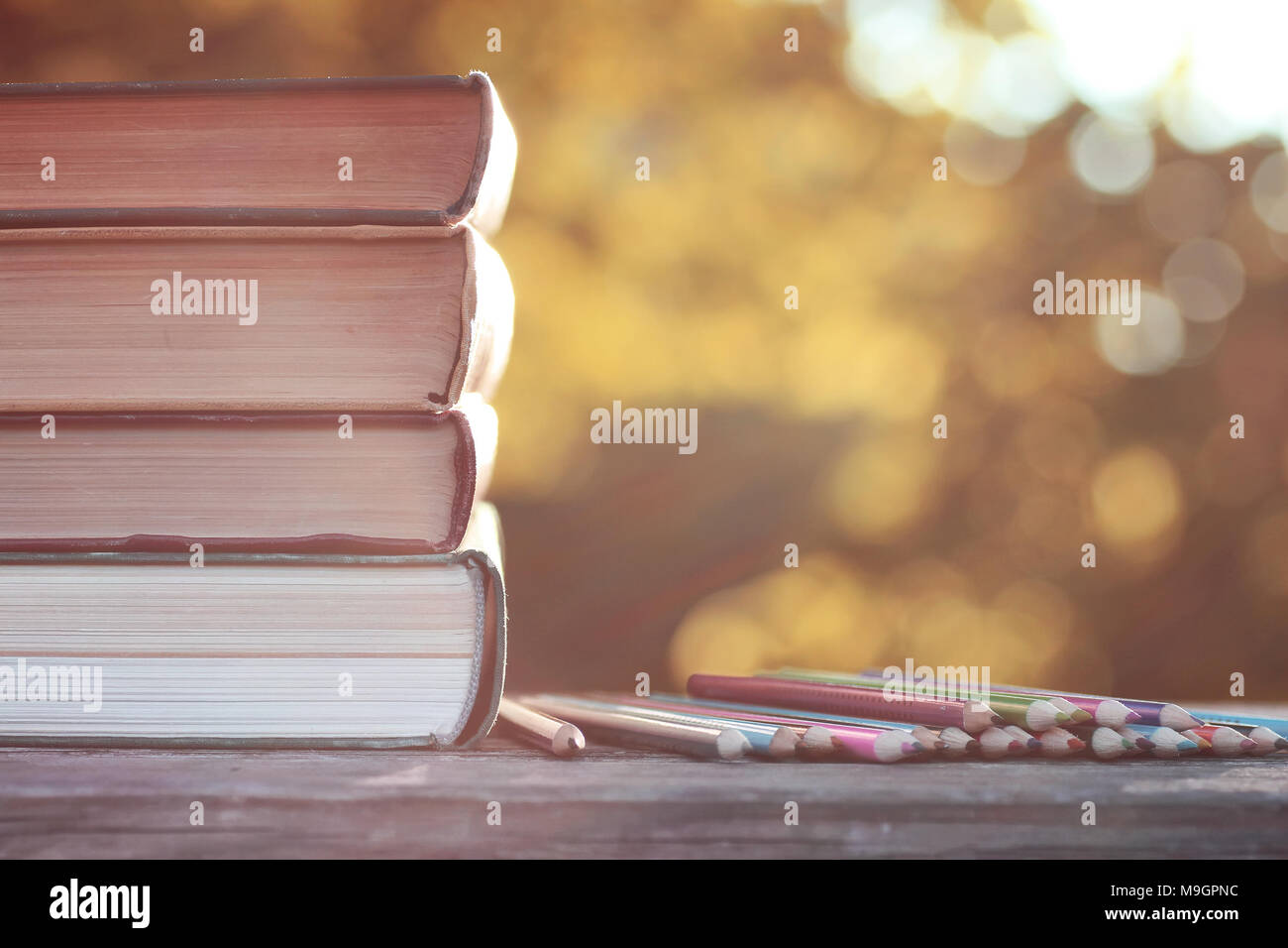 autumn book stack wooden outdoor Stock Photo - Alamy