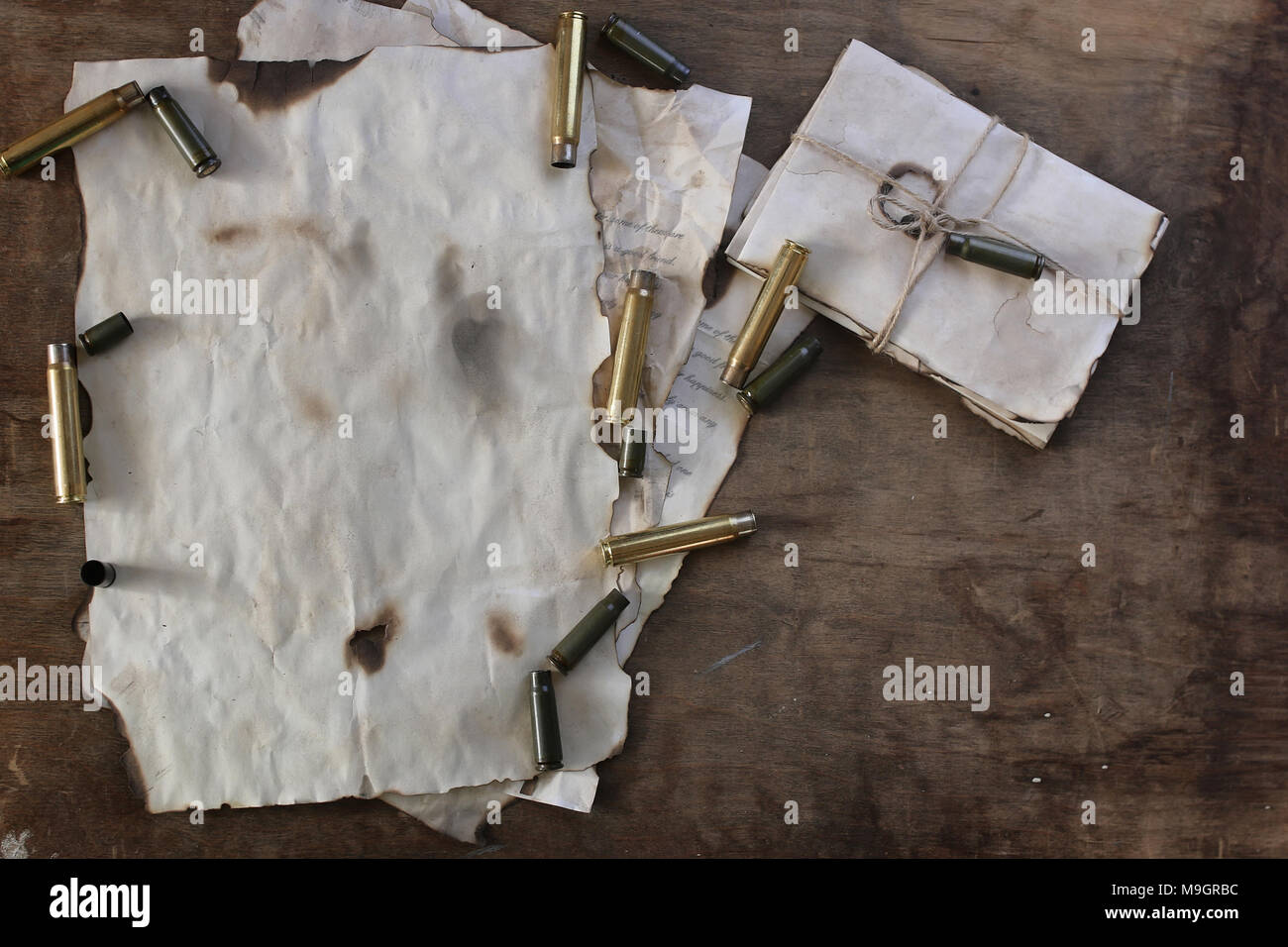 bullet and retro paper on the table Stock Photo - Alamy