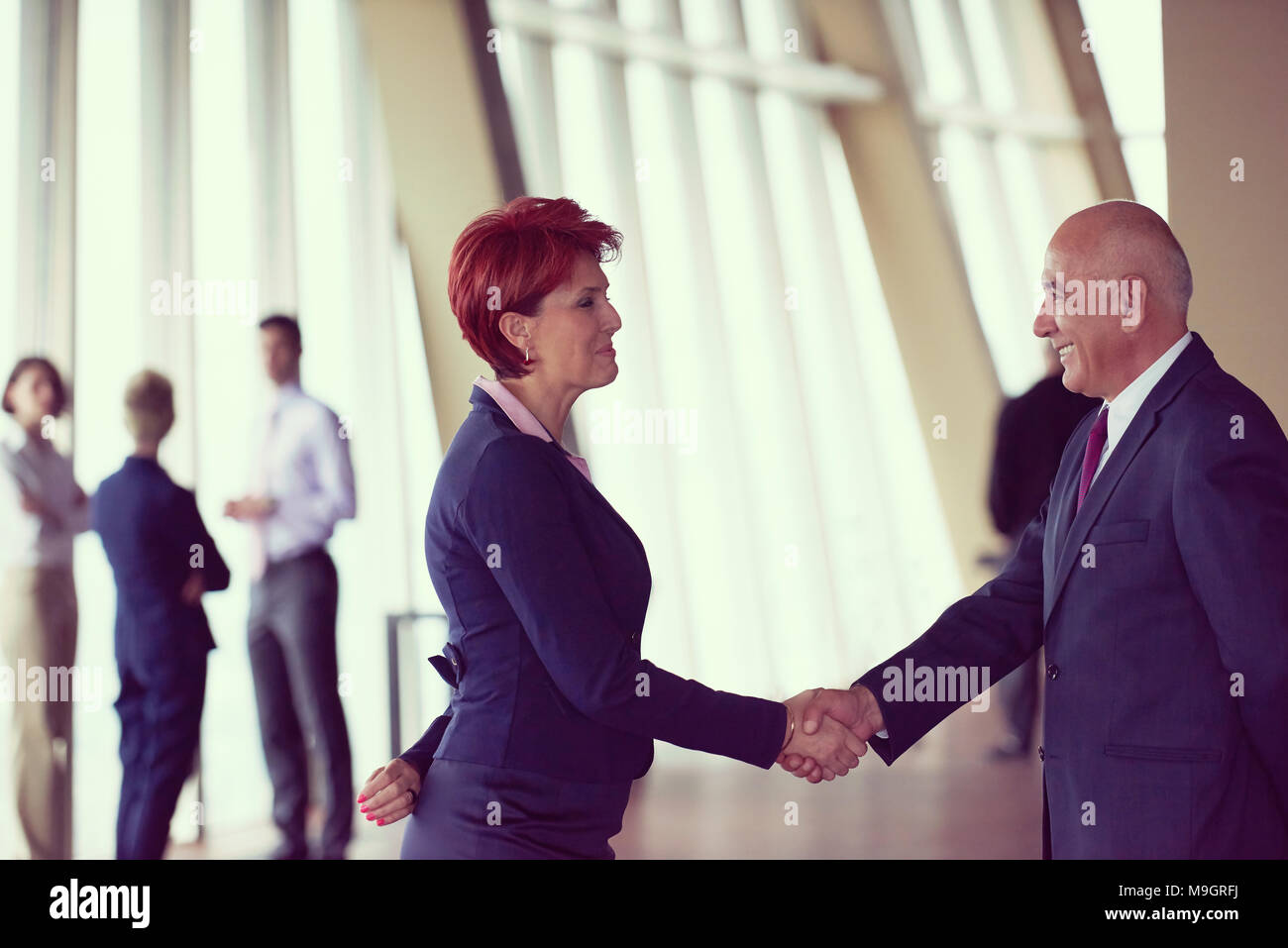partnership concept with senior business man and woman make hand shake ...