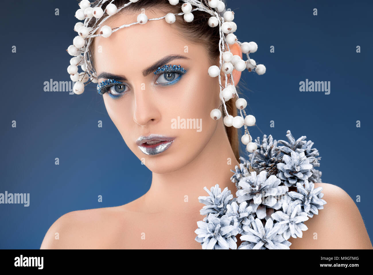 tender woman with hair accessory, christmas pine cones, winter makeup ...