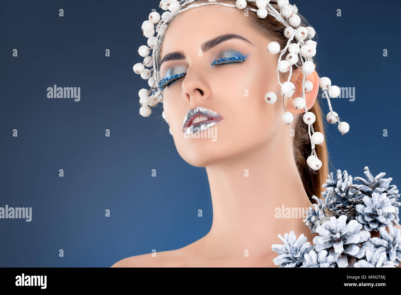 tender woman with hair accessory, christmas pine cones, winter makeup ...