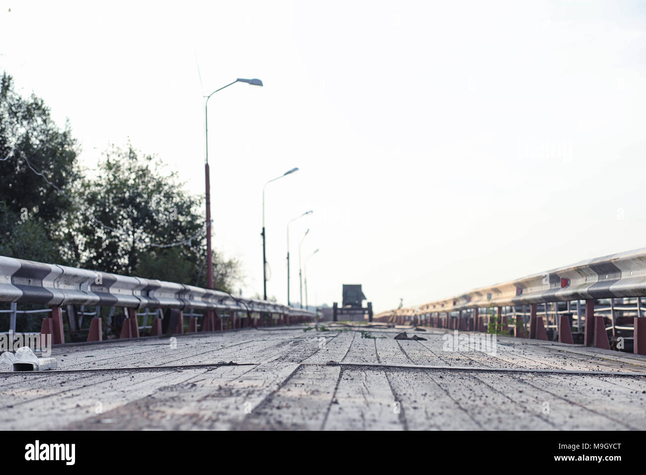 Wooden bridge on the river bank. A wooden road with pillars. Pan Stock ...