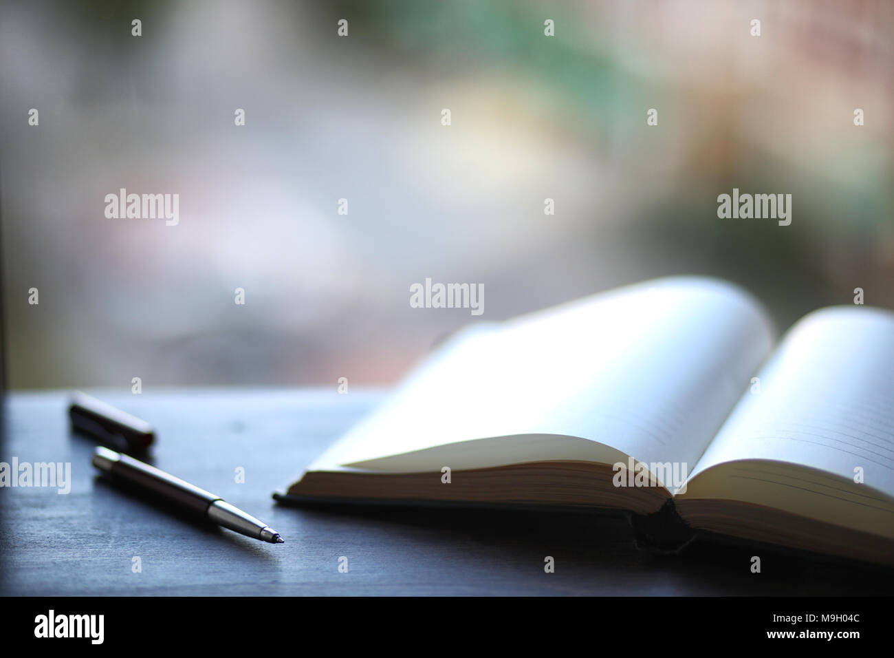 open book and a table Stock Photo - Alamy