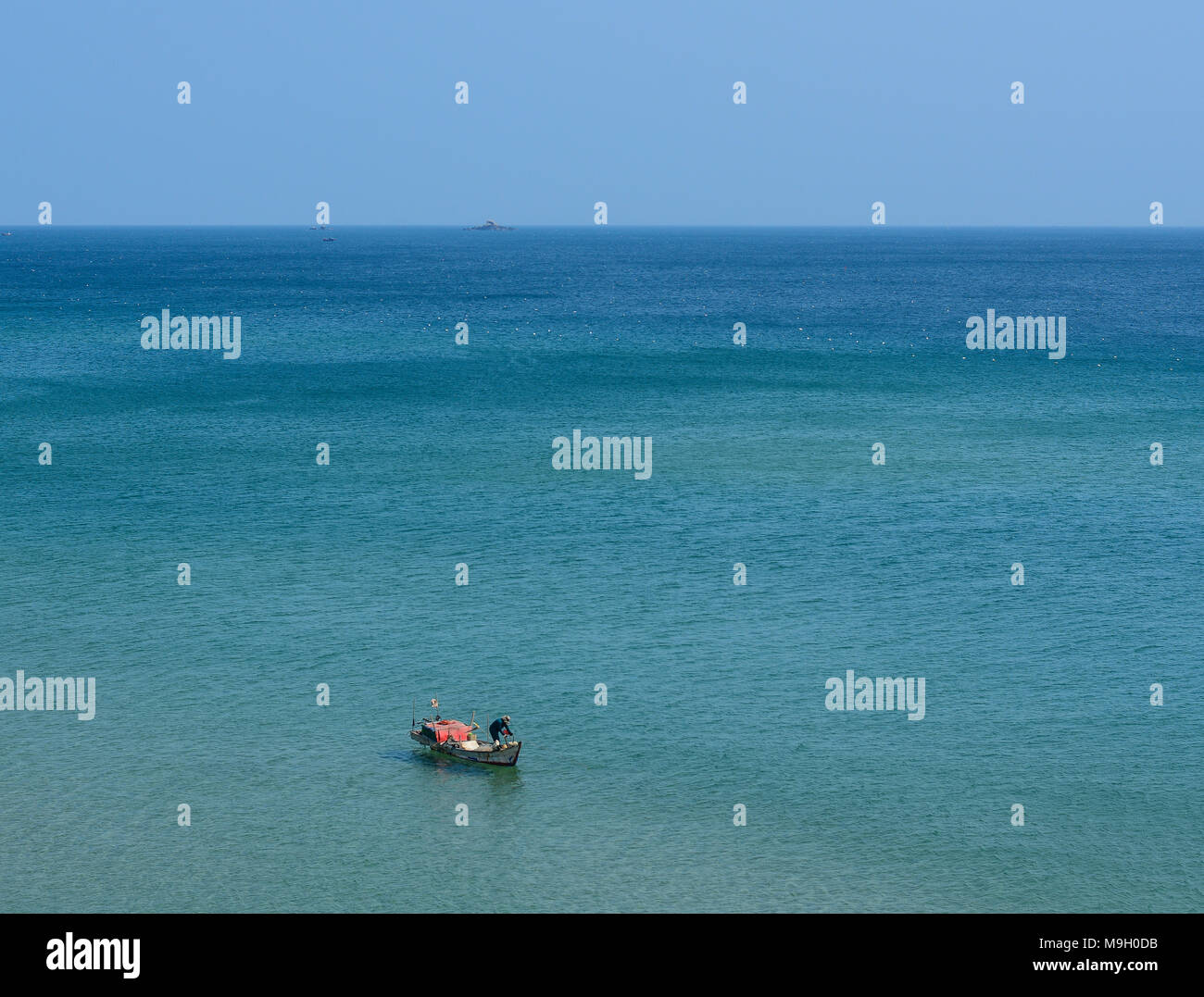 A lonely boat on the sea at summer day in Danang, Vietnam Stock Photo ...