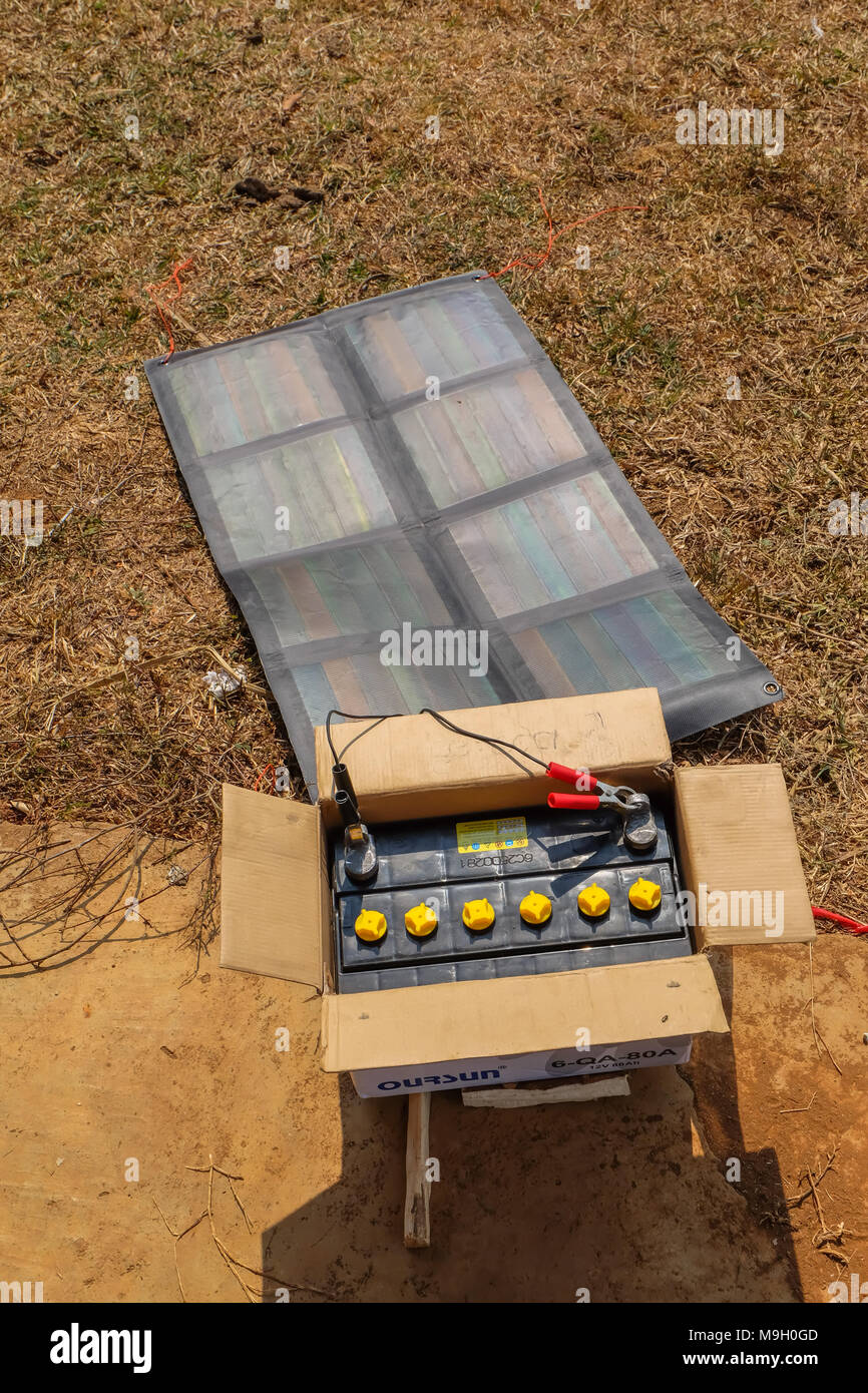 Tachileik, Myanmar - March 30 2017. Flexible solar panel charging a ...
