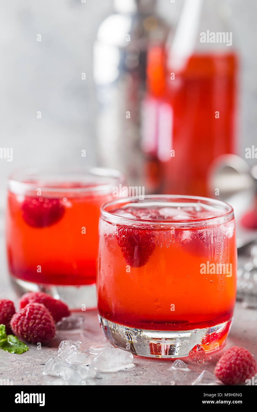 Red refreshing cold raspberry lemonade in a glasses with ice and ...