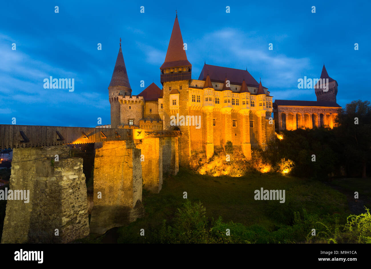 Impressive night landscape with illuminated medieval Corvin Castle on ...