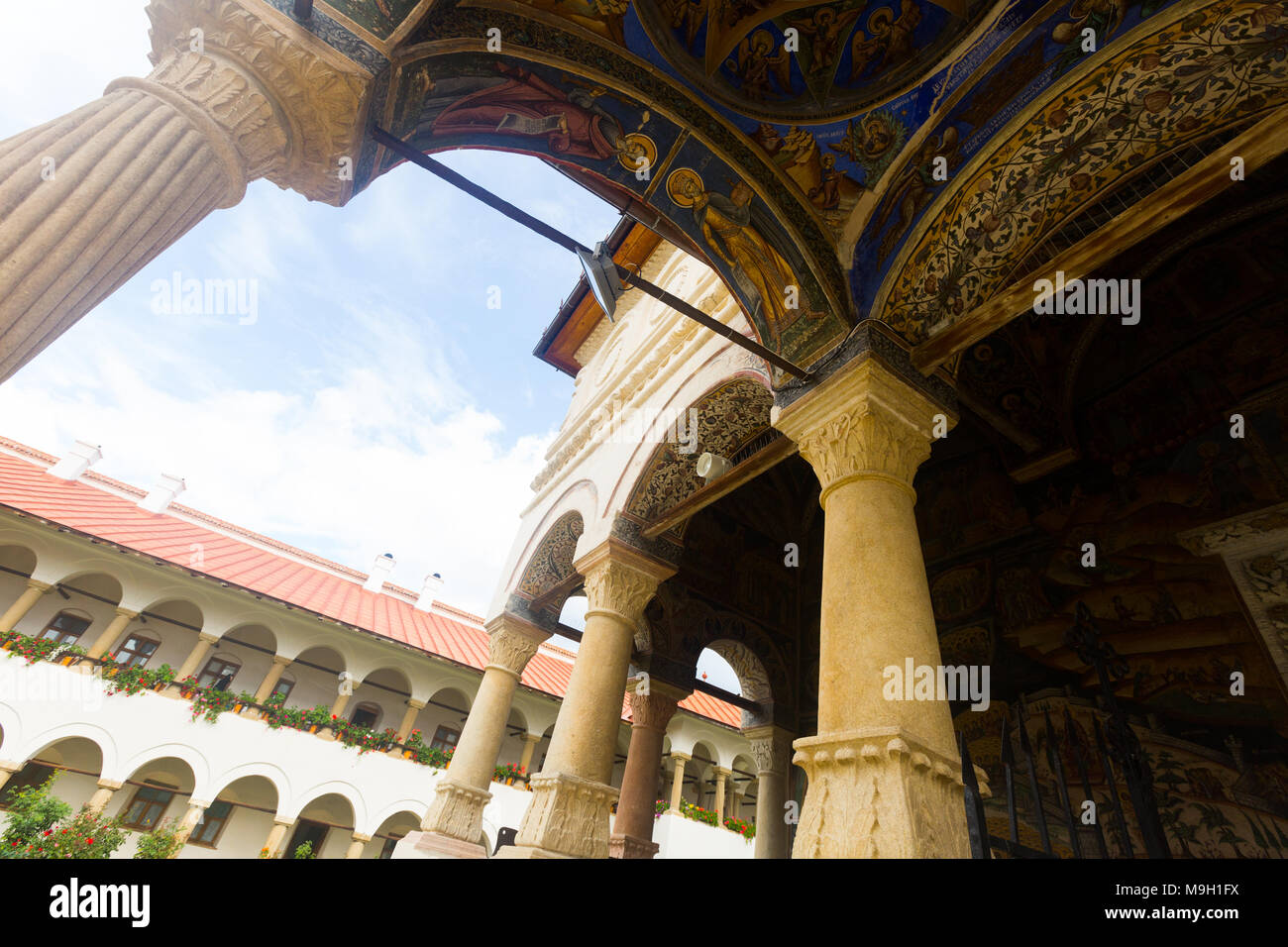 Closeup of porch of church at Horezu Monastery with colorful religious ...