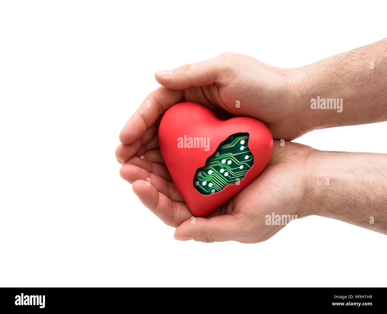 Red computer heart in hands isolated on white with clipping path Stock ...