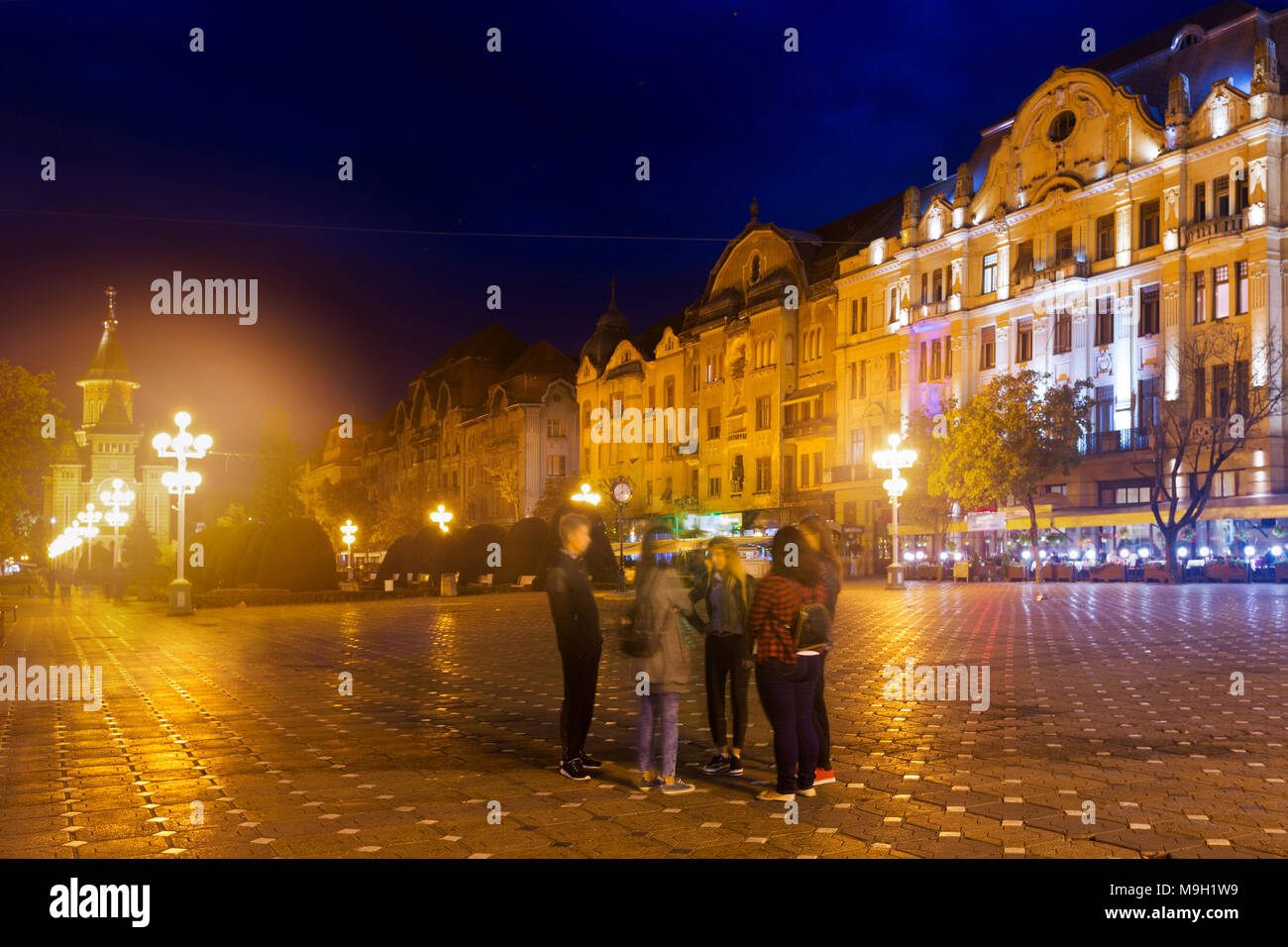 Night view of Victoriei Square on background with Romanian Orthodox ...