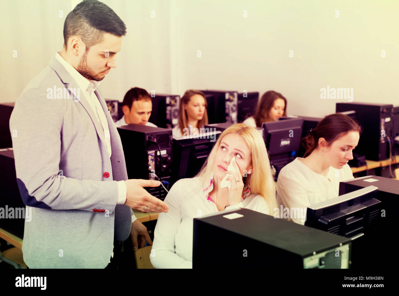 Furious supervisor scolding unhappy office worker Stock Photo - Alamy