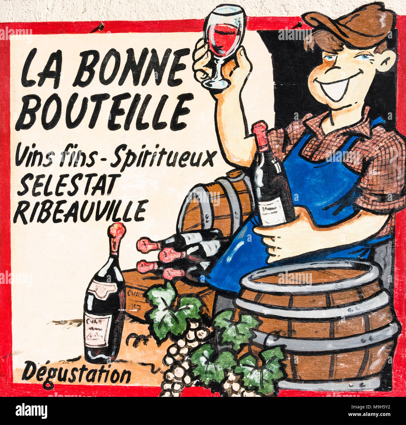 Wine shop sign in the the medieval town of Ribeauville, Alsatian Wine ...